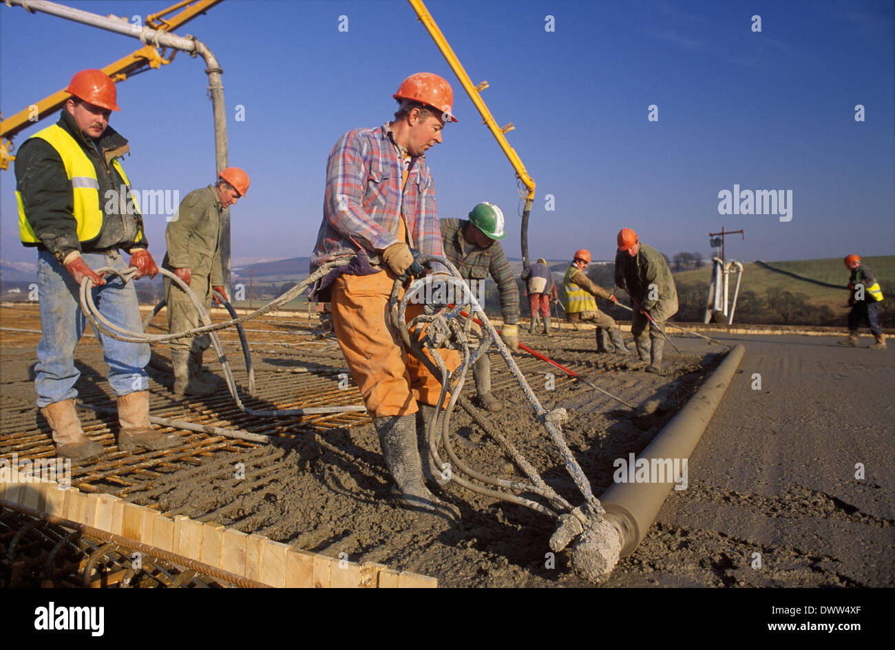 Motorway Construction, Pouring and levelling concrete Stock Photo - Alamy