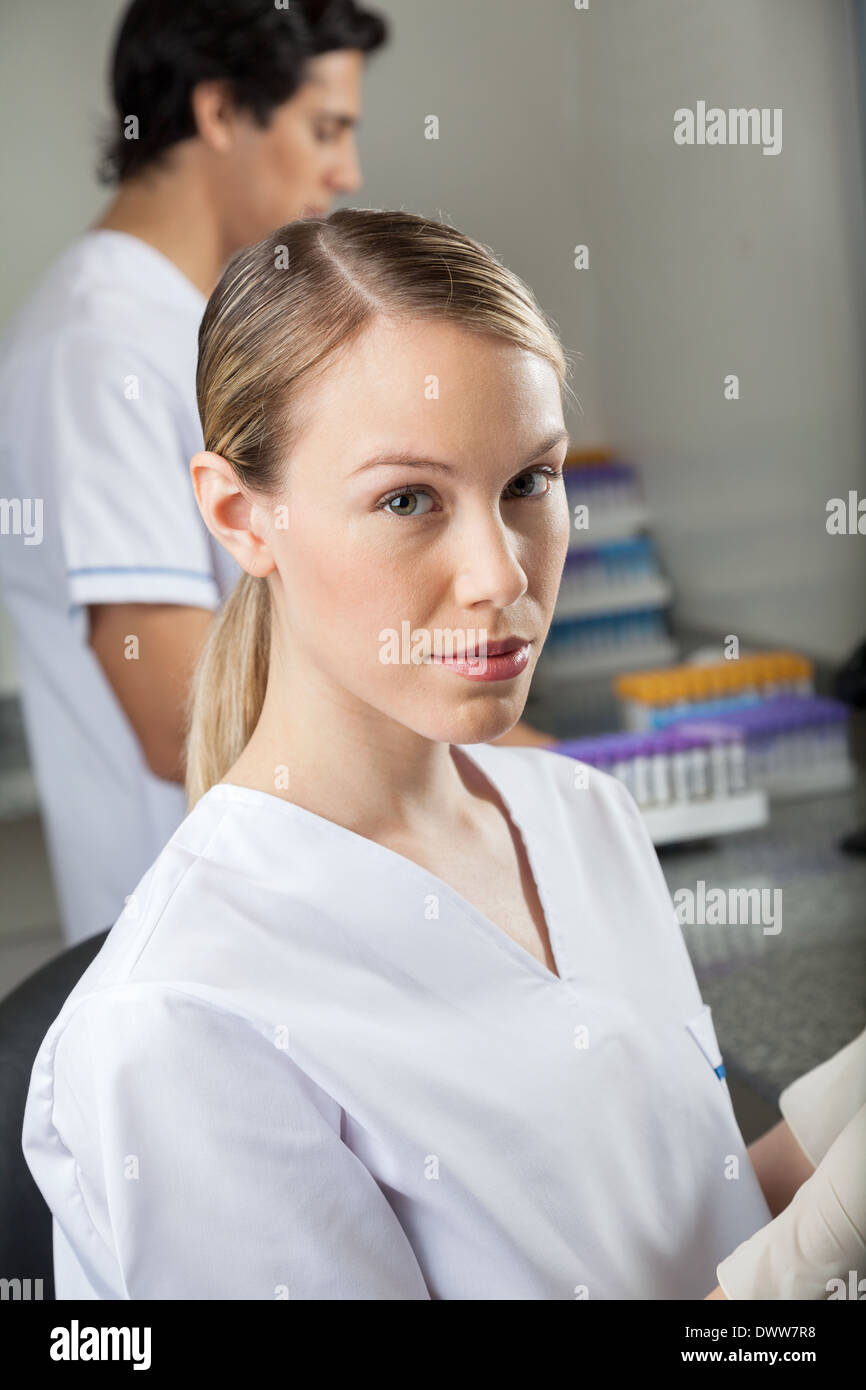 Female Lab Technician With Colleague Stock Photo - Alamy