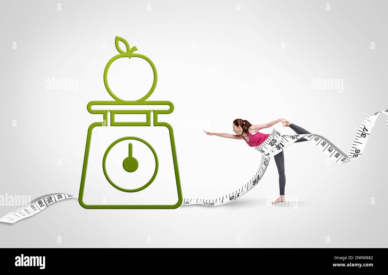 a woman stretching next to a scale Stock Photo - Alamy