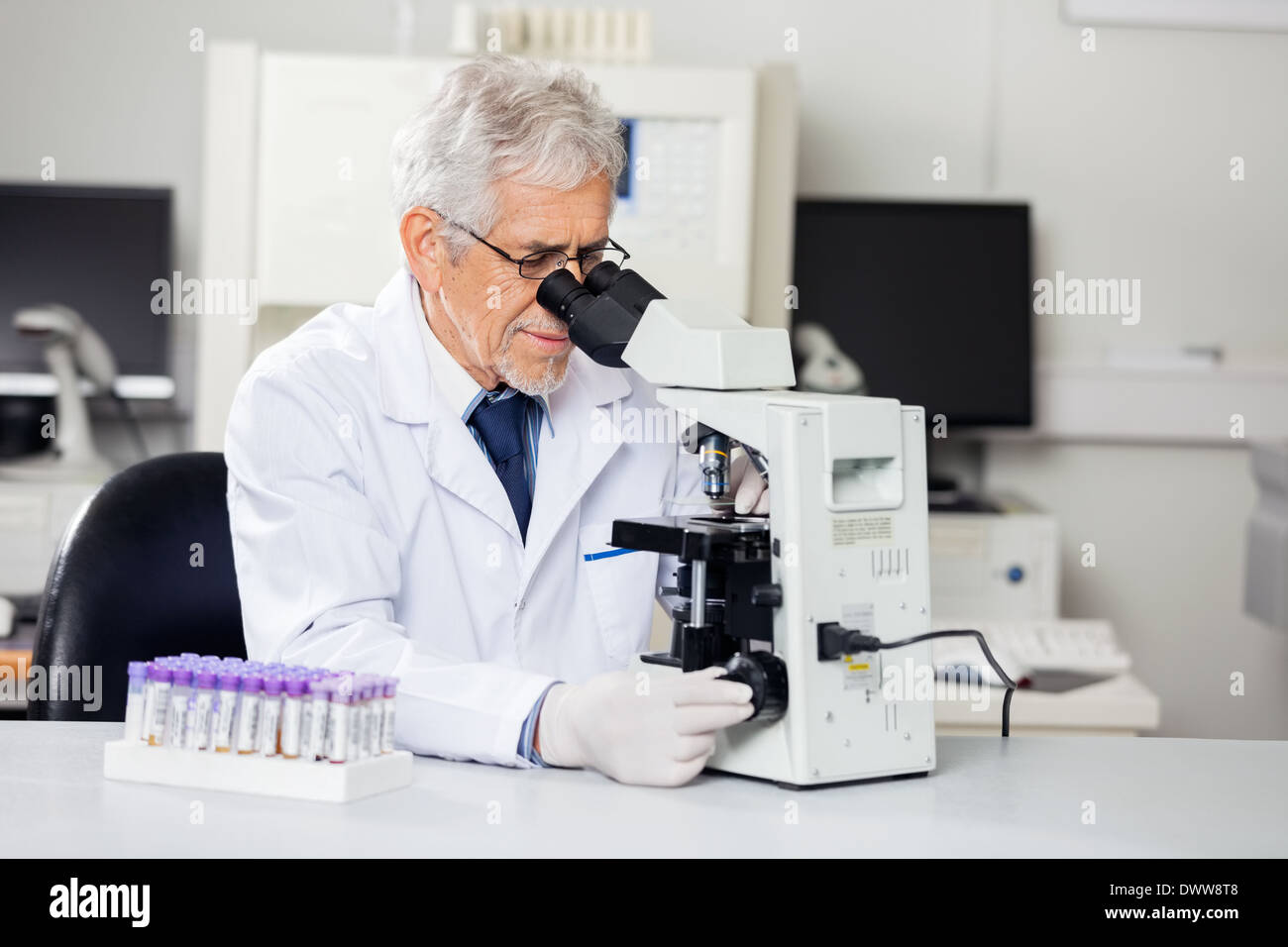 Male Researcher Using Microscope In Lab Stock Photo - Alamy