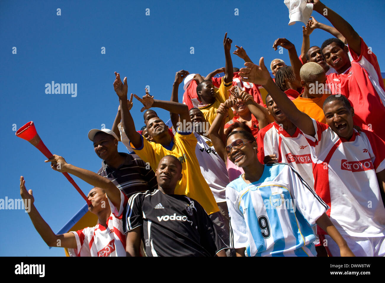 Cheering supporters of the Atlantics and Mountain Birds soccer team in ...