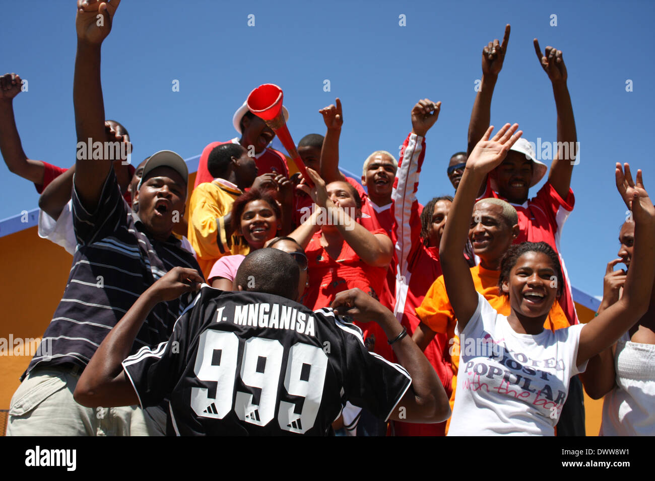 Cheering supporters of the Atlantics and Mountain Birds soccer team in ...
