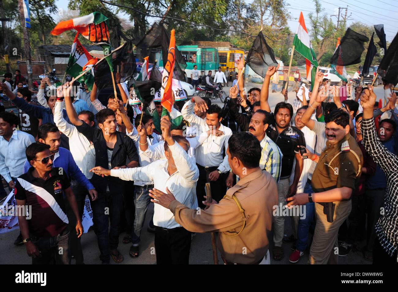 Allahabad, India. 13th March 2014. Congress worker raise their black ...