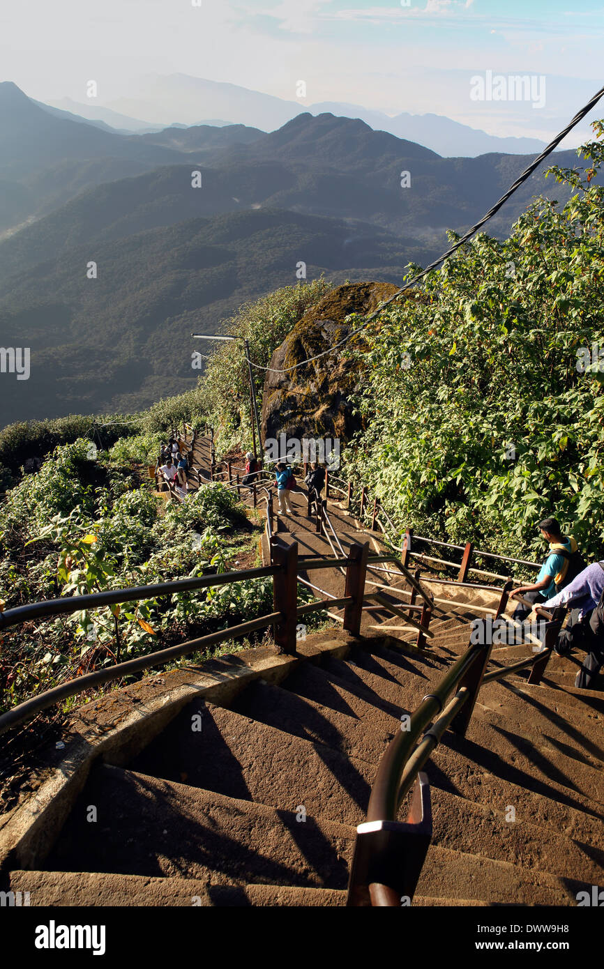 Buddhist pilgrims on the steep staircase near the summit of Adam's Peak ...