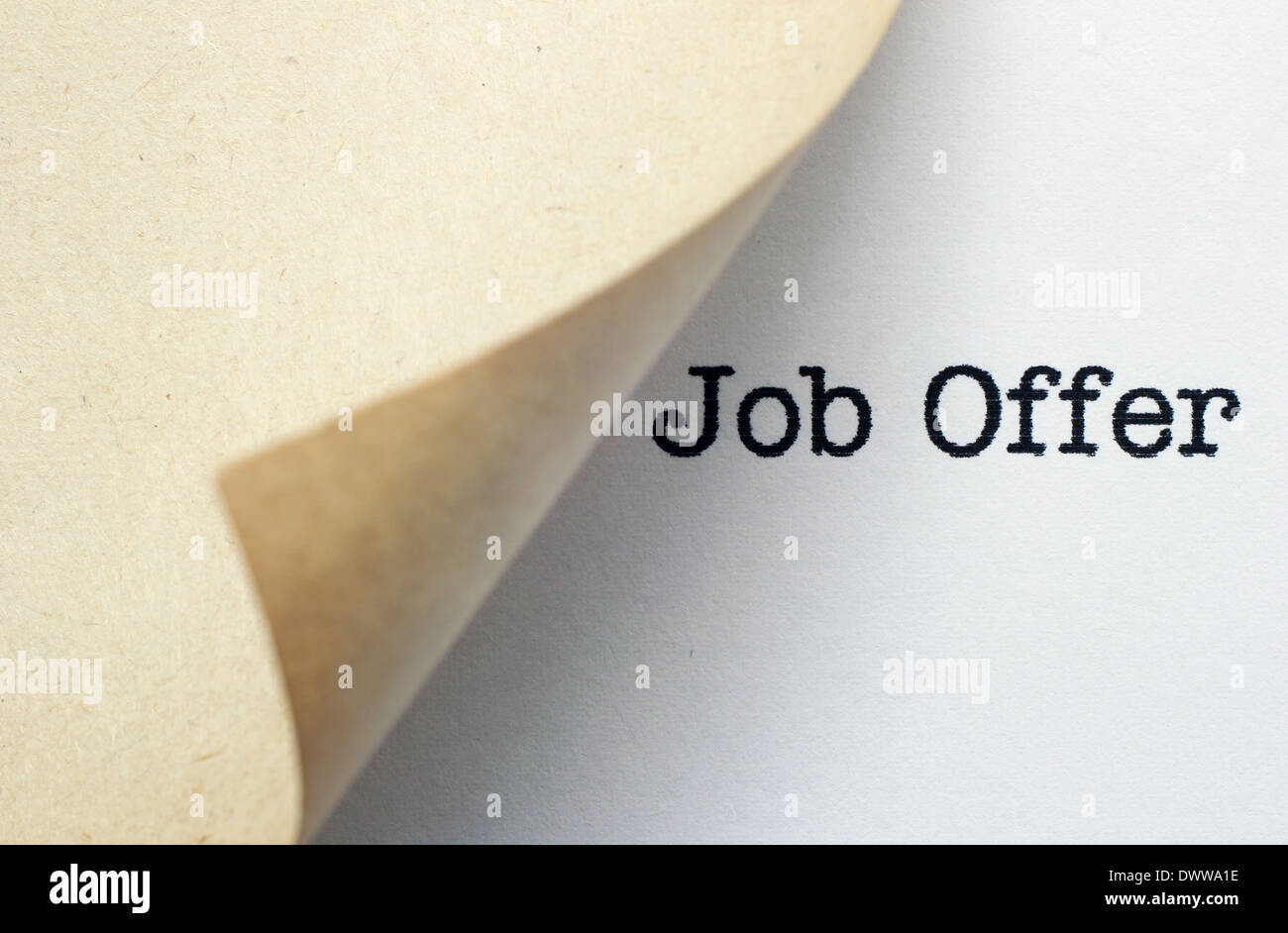 Job Offer text behind paper Stock Photo - Alamy
