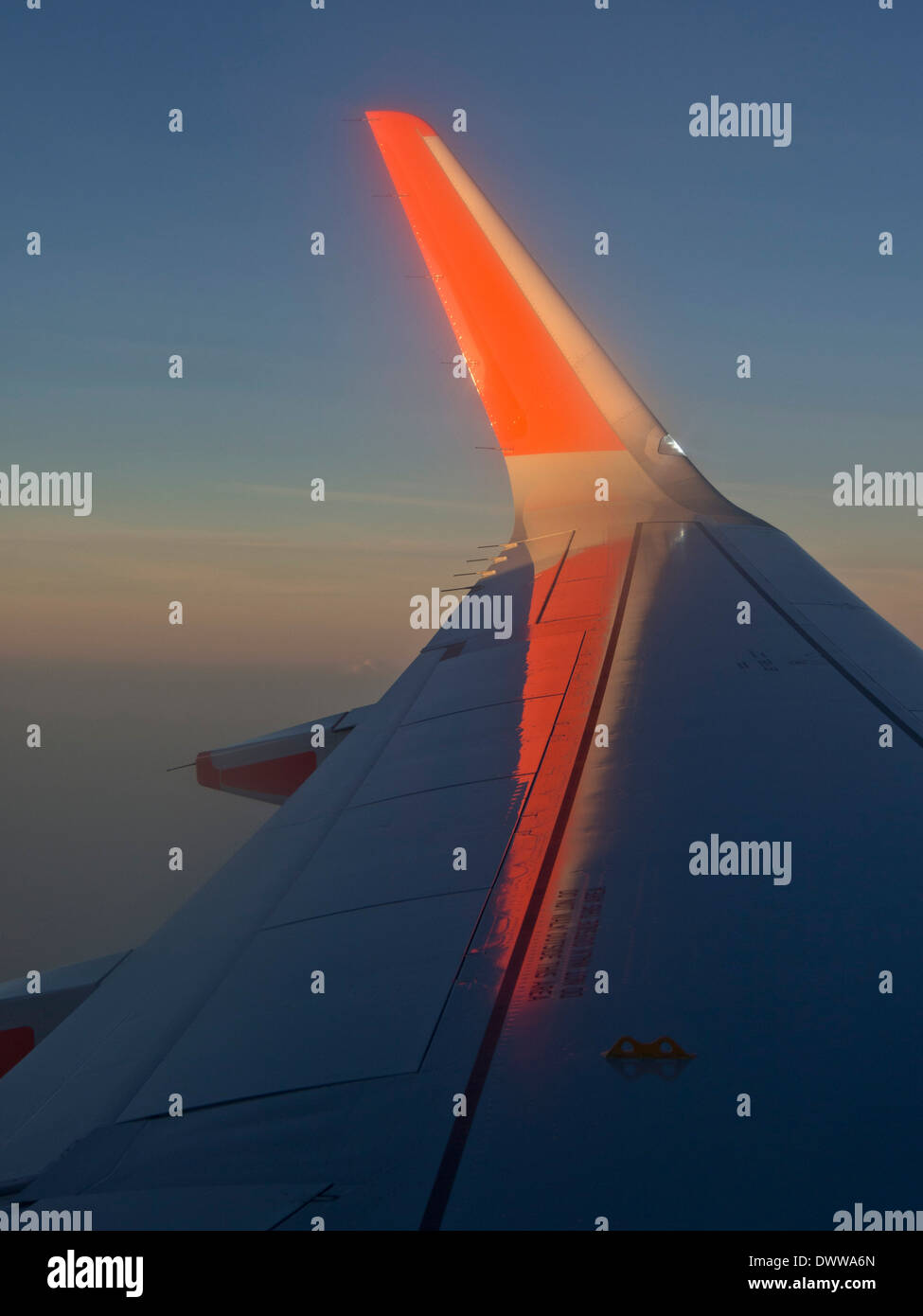 View of wing of Jetstar airplane at sunset from passenger seat after ...
