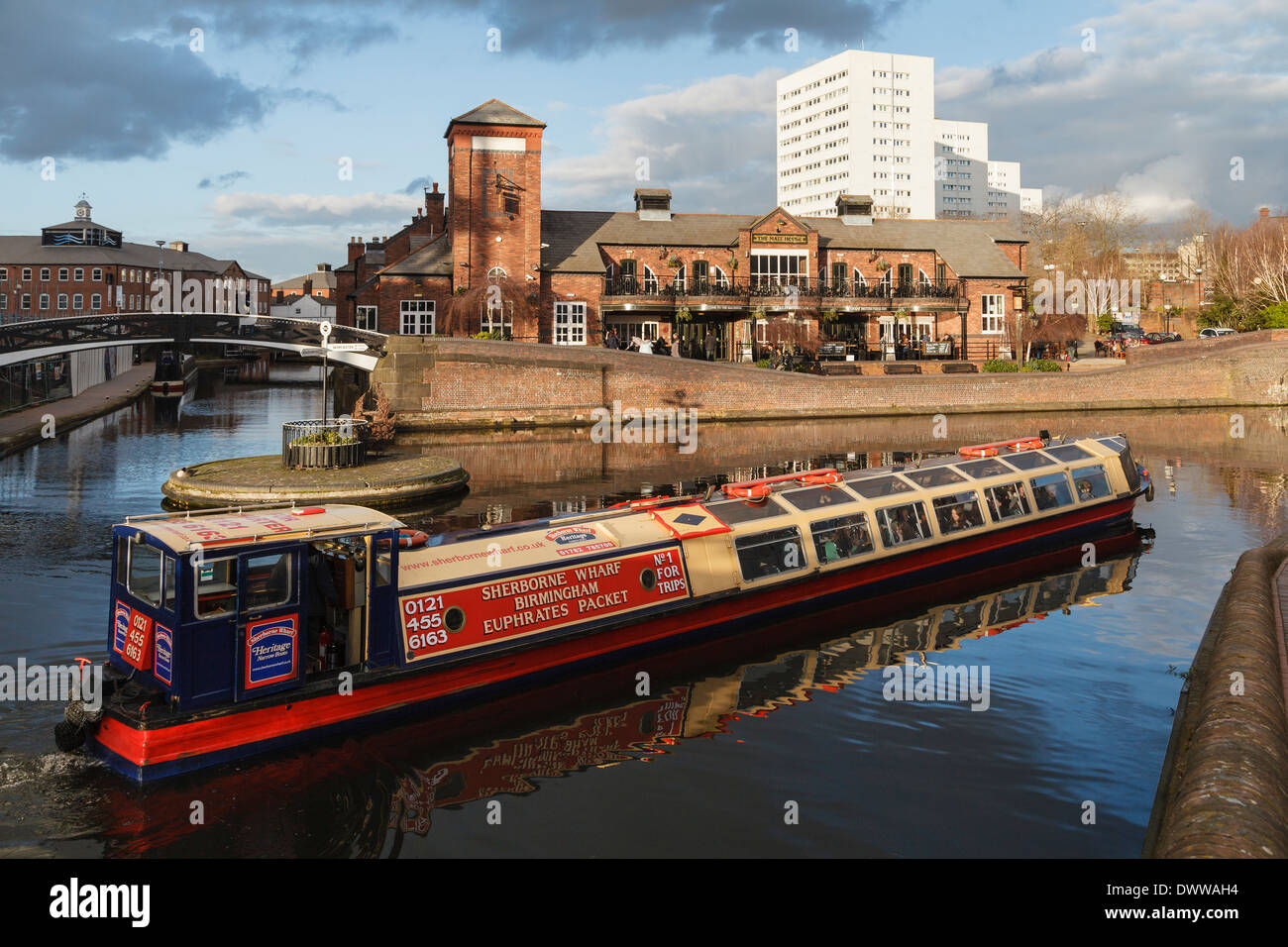 A tourist narrowboat passes Old Turn Junction, Birmingham Canal ...