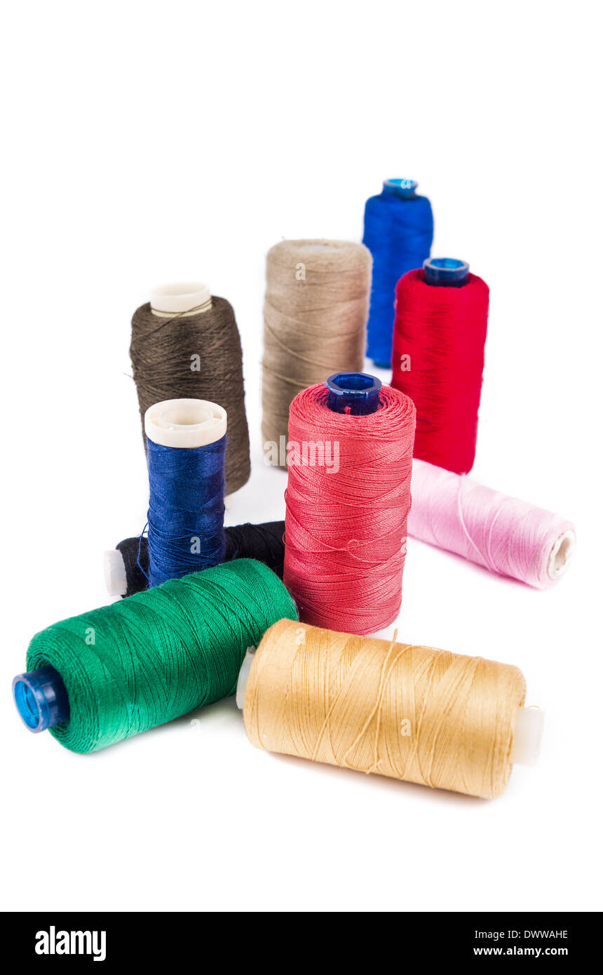 Pile of coloured bobbins of thread Stock Photo - Alamy