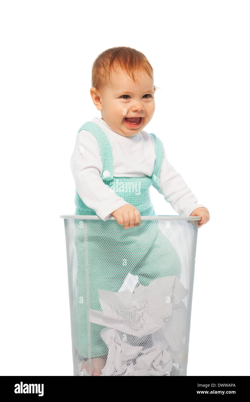 Little baby girl standing in the garbage bin with crumpled paper Stock ...