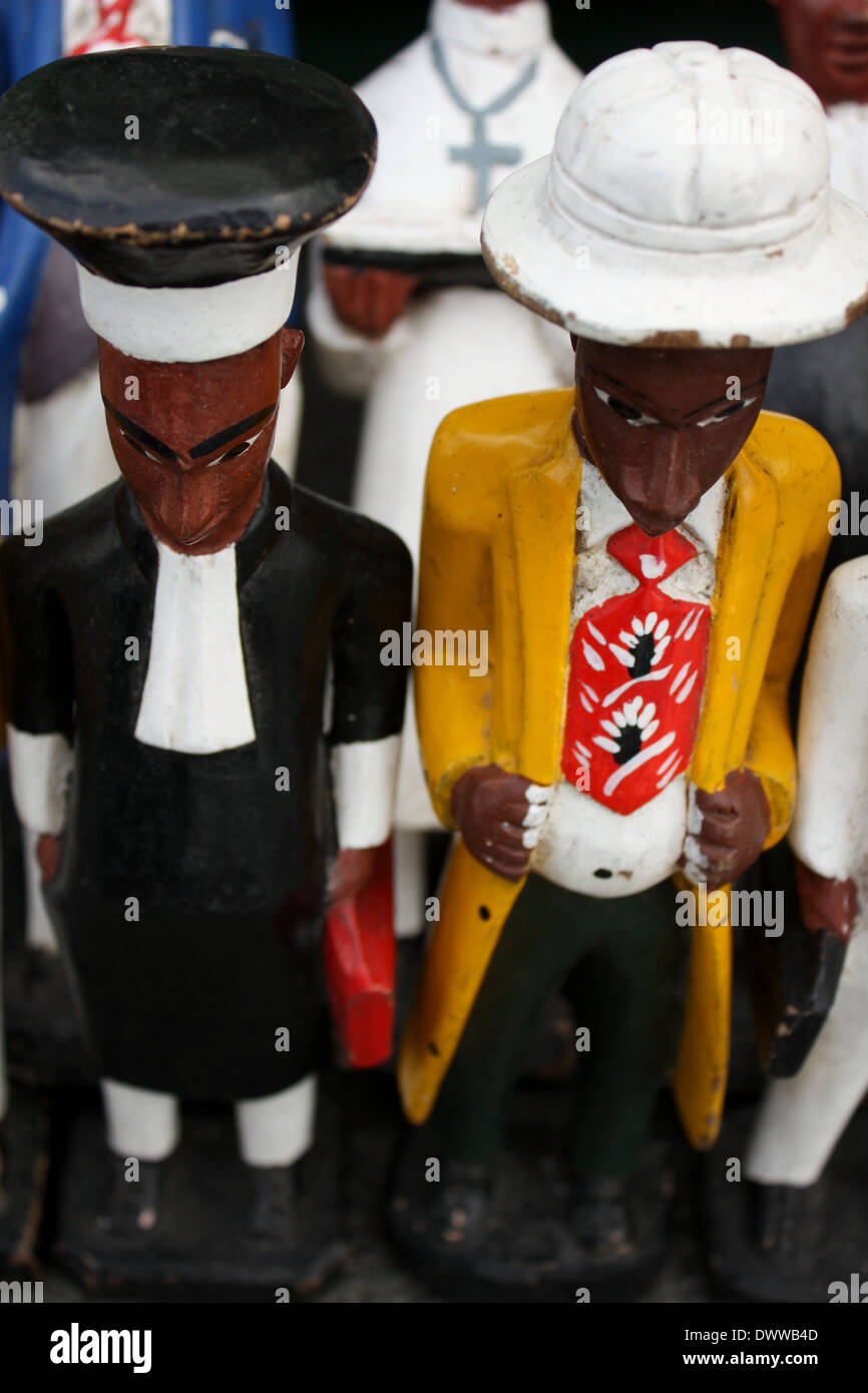 Wooden figurines made in Zimbabwe are sold at a craft market in ...