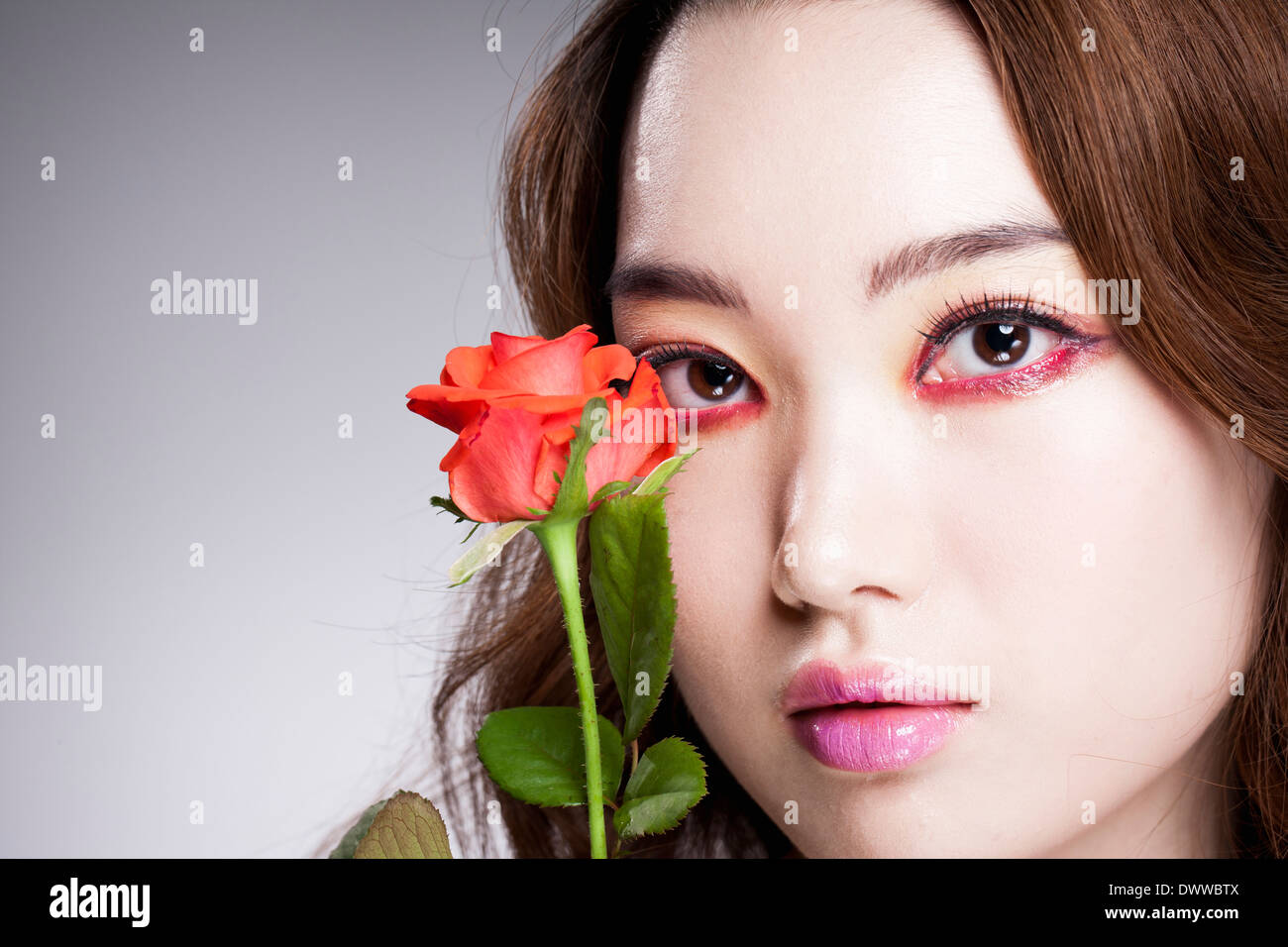 A woman with a red rose hi-res stock photography and images - Alamy