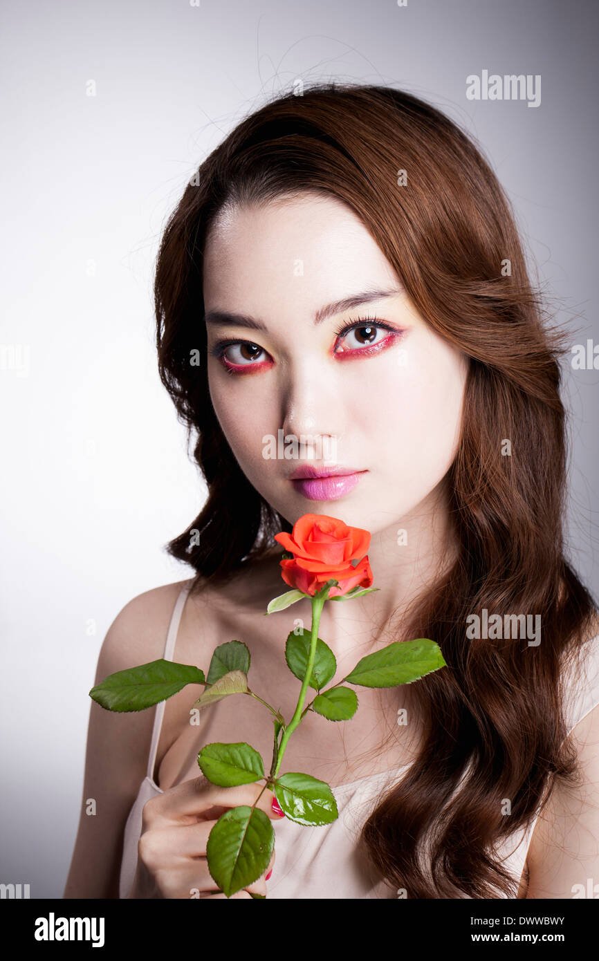 A woman with a red rose hi-res stock photography and images - Alamy