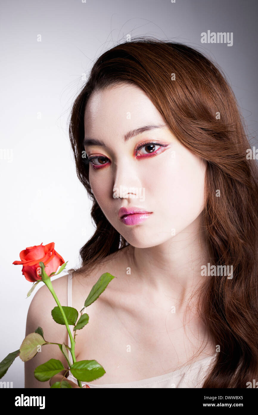 A woman with a red rose hi-res stock photography and images - Alamy