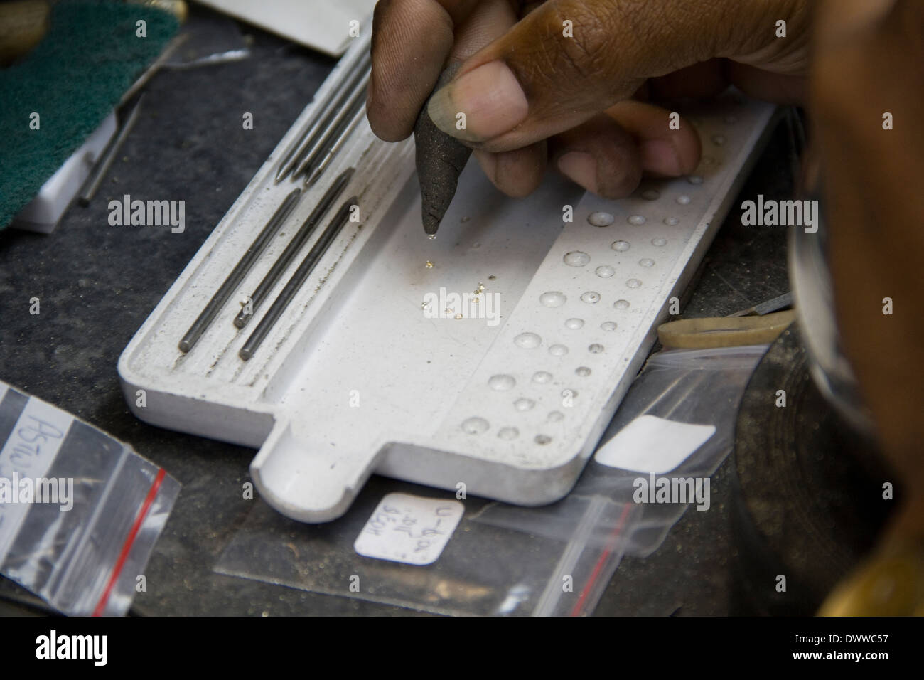 Stone setter Clive Alies ensure the correct and secure setting of ...