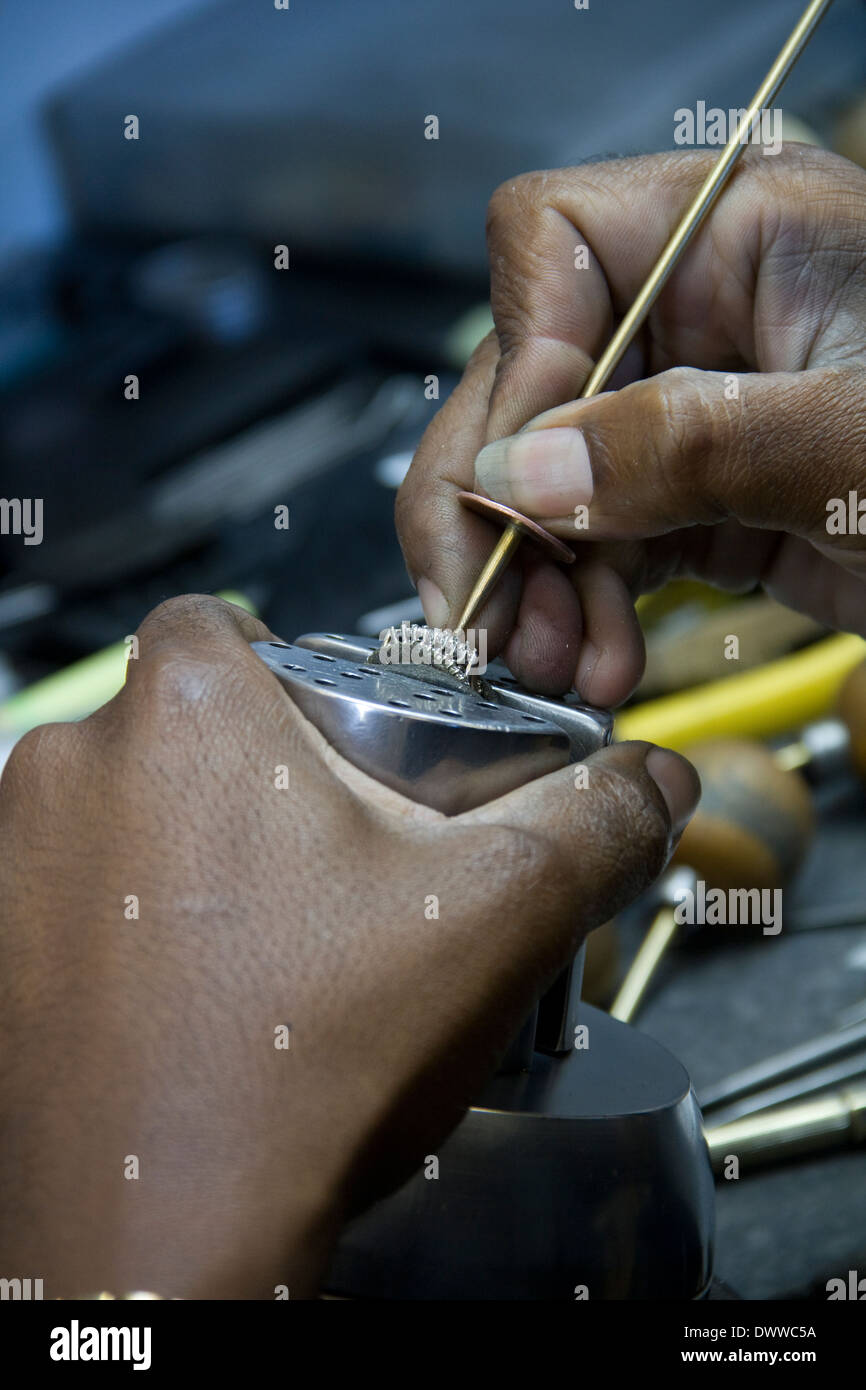 Stone setter Clive Alies ensure the correct and secure setting of ...