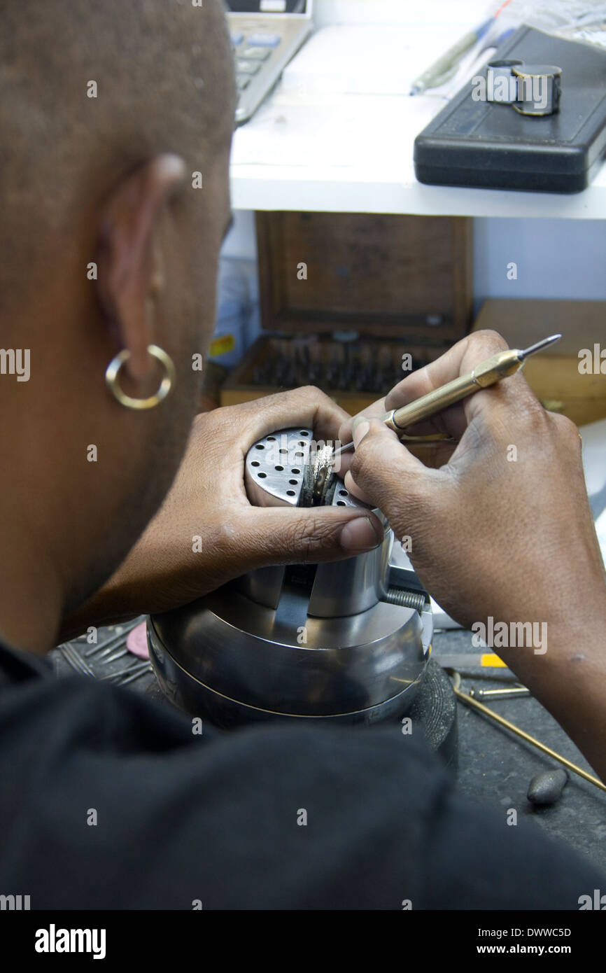 Stone setter Clive Alies ensure the correct and secure setting of ...