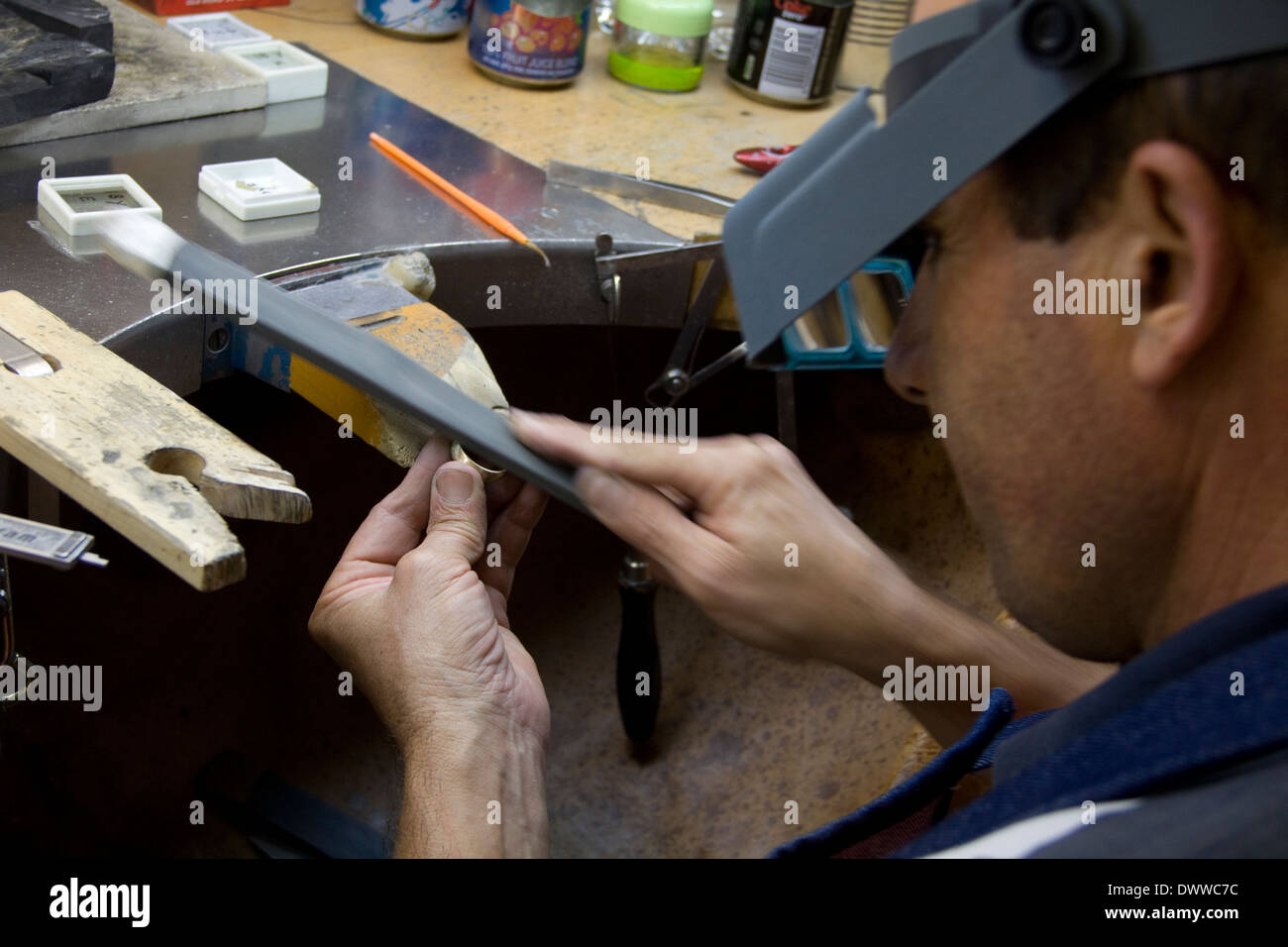 Zimbabwean-Italian goldsmith Roberto Spagnuolo is filing a yellow-gold ...