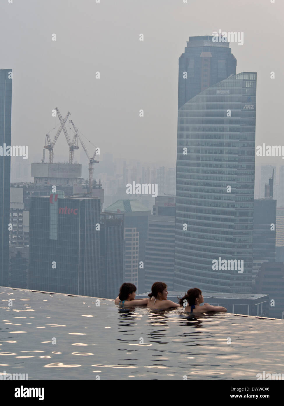Guests relax at the Infinity Pool at the famous Marina Bay Sands Hotel ...
