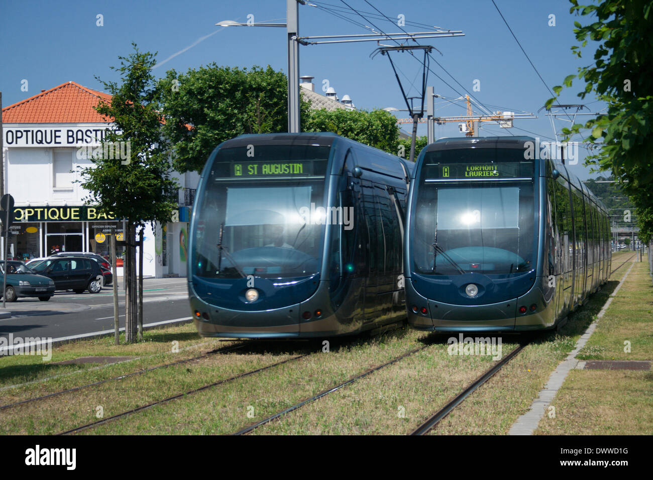 Two public transportation Tramway trains using overhead wires in ...