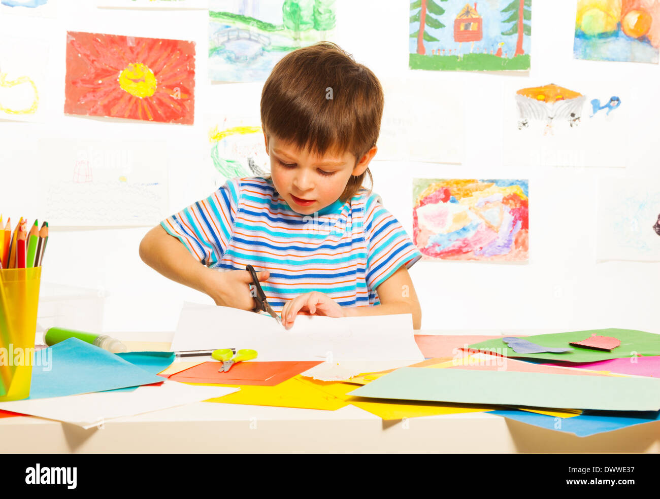 Boy cutting drawing scissors hi-res stock photography and images - Alamy