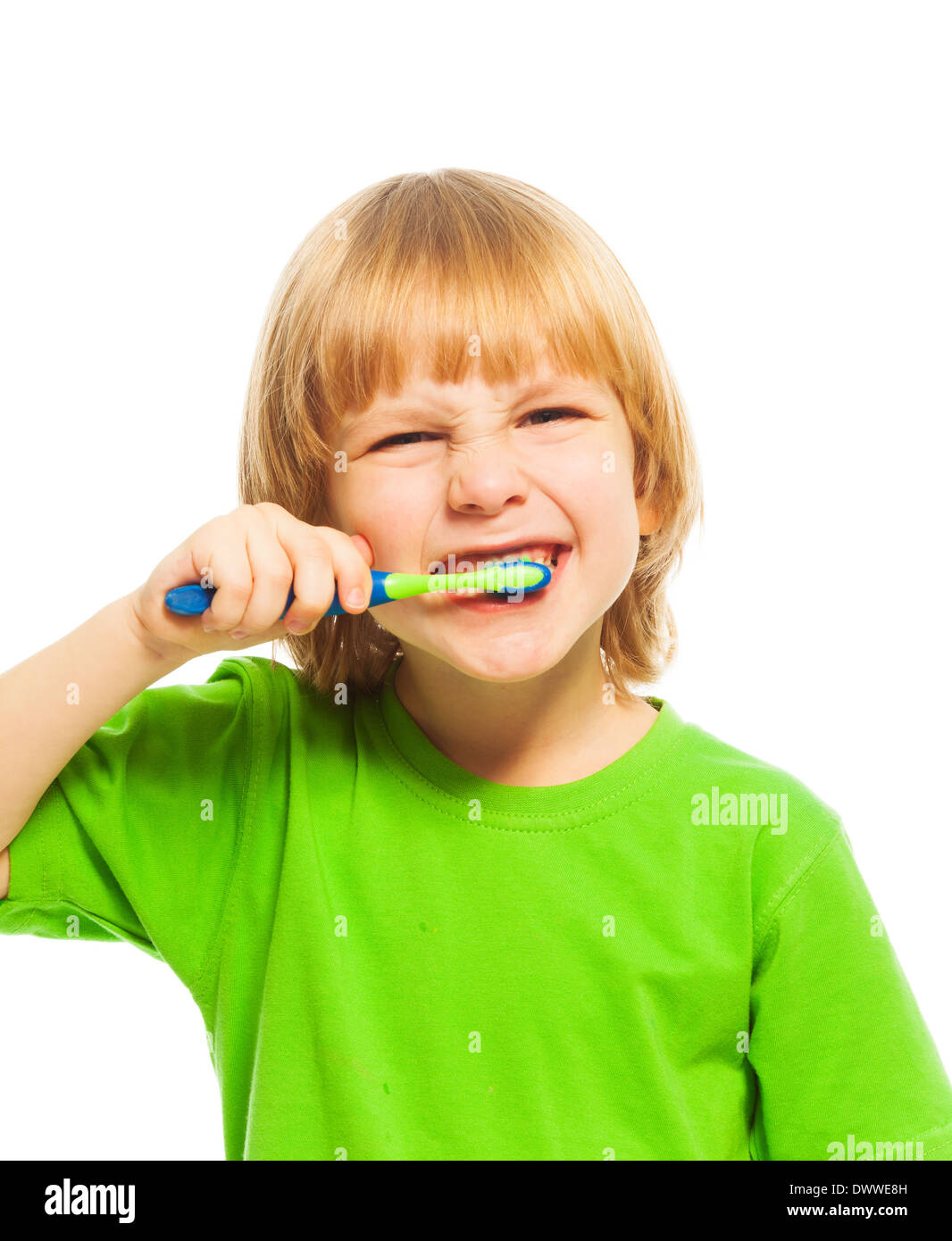 Close portrait of blond 4 years old boy boy brushing teeth with ...