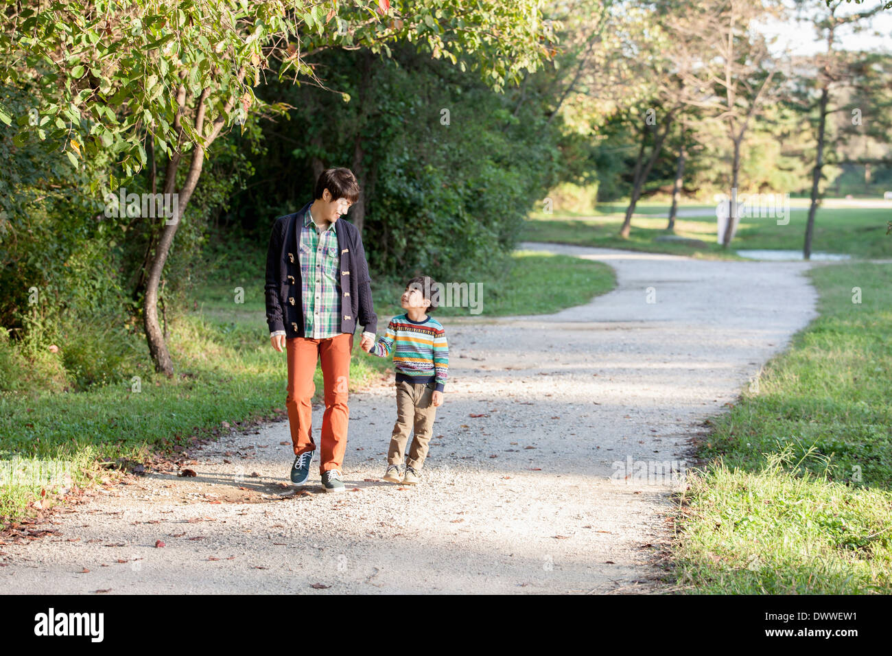 a father and a kid having a walk in the nature Stock Photo - Alamy