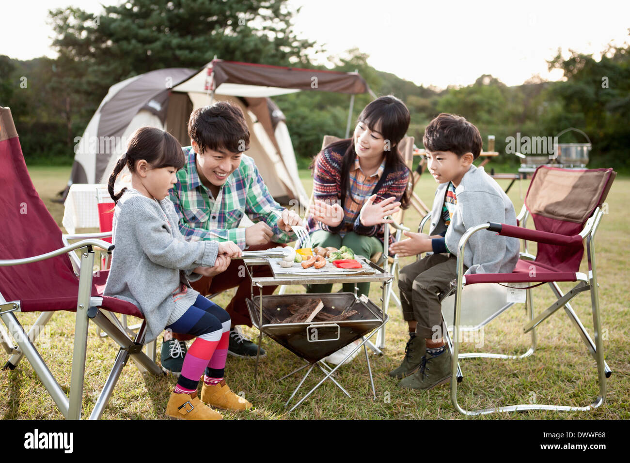a family out camping Stock Photo - Alamy