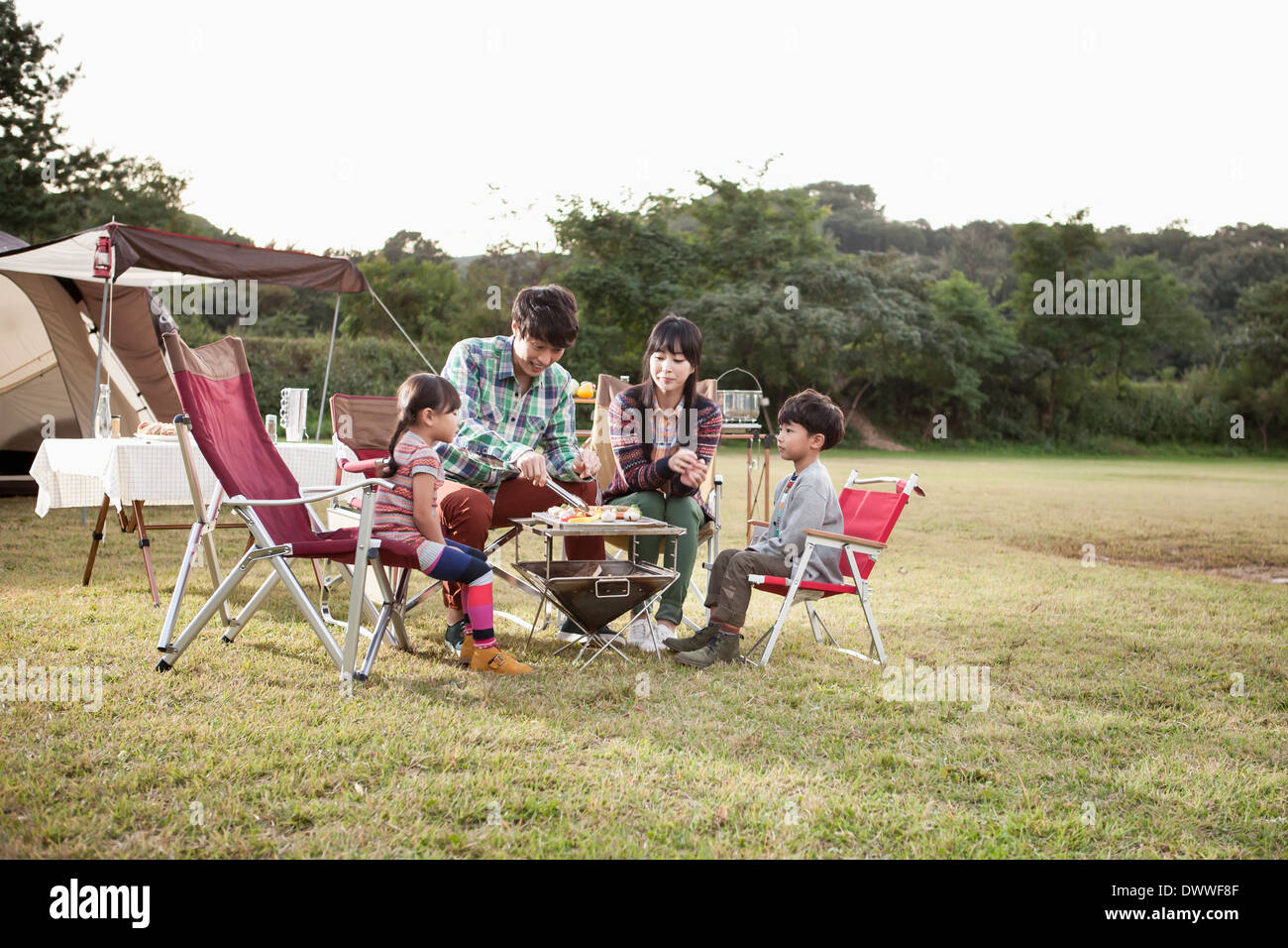 a family out camping Stock Photo - Alamy