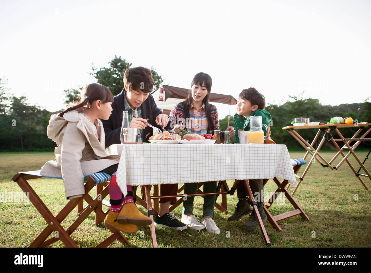 a family out camping Stock Photo - Alamy