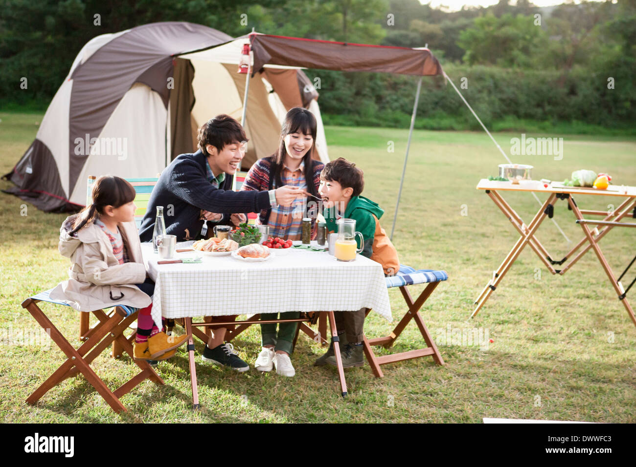 a family out camping Stock Photo - Alamy