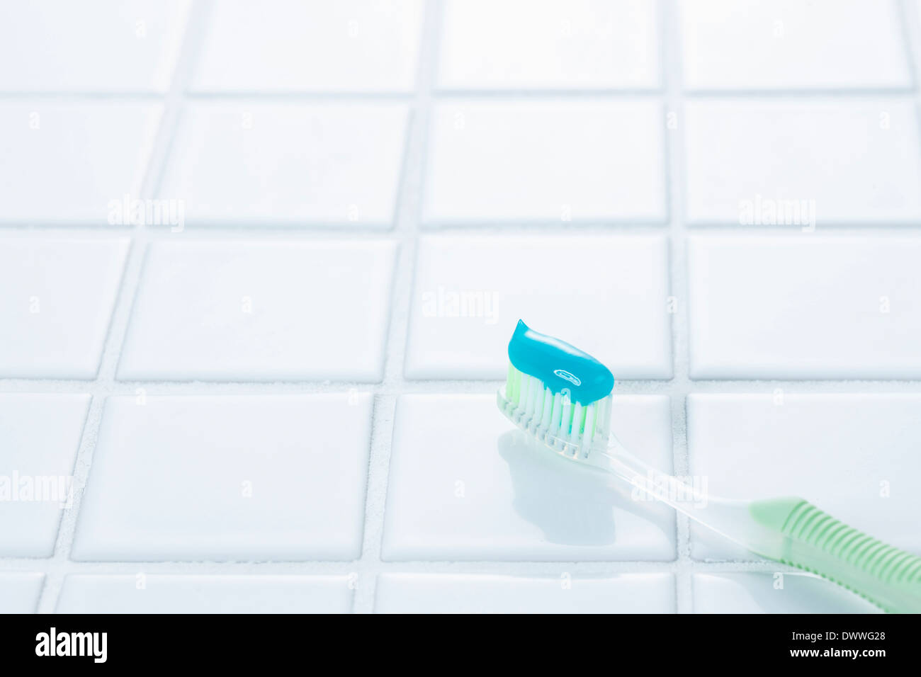 a toothbrush with toothpaste Stock Photo - Alamy