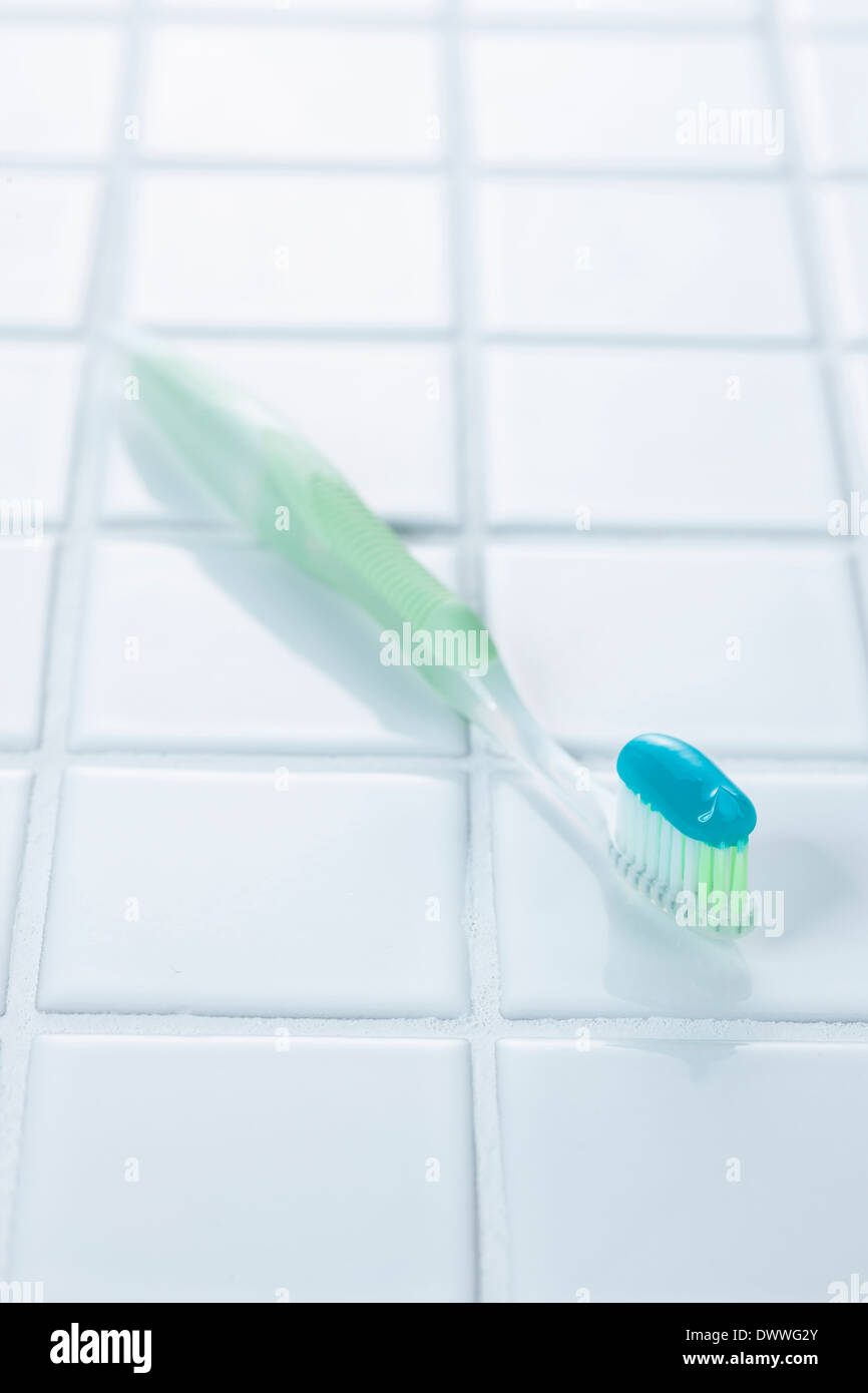 a toothbrush with toothpaste Stock Photo - Alamy