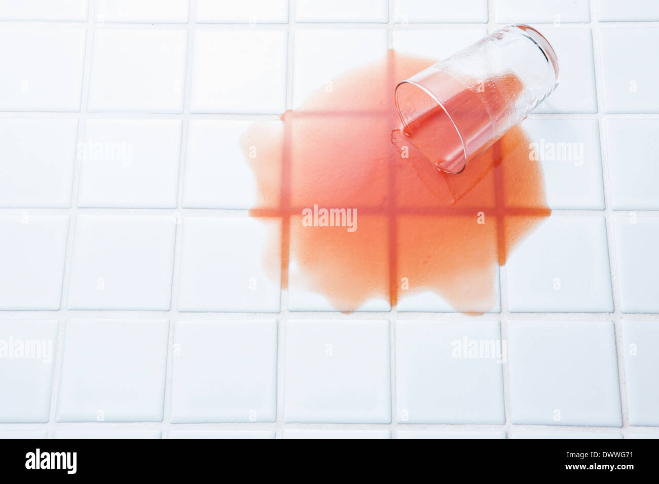 red liquid spilled on the floor Stock Photo - Alamy