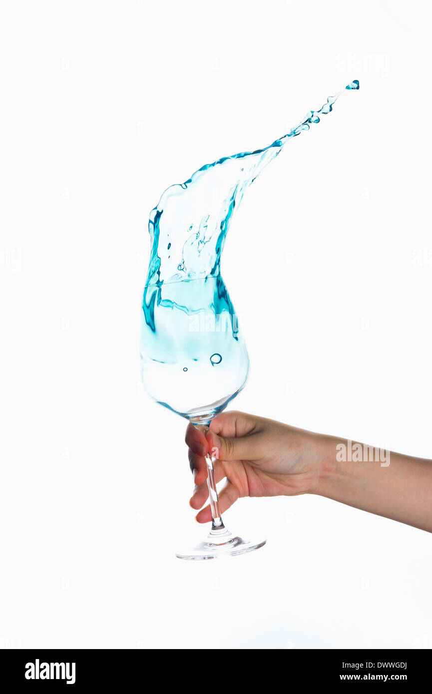 wine glass spilling liquid Stock Photo - Alamy