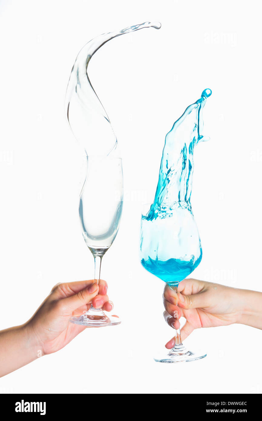 wine glass spilling liquid Stock Photo - Alamy