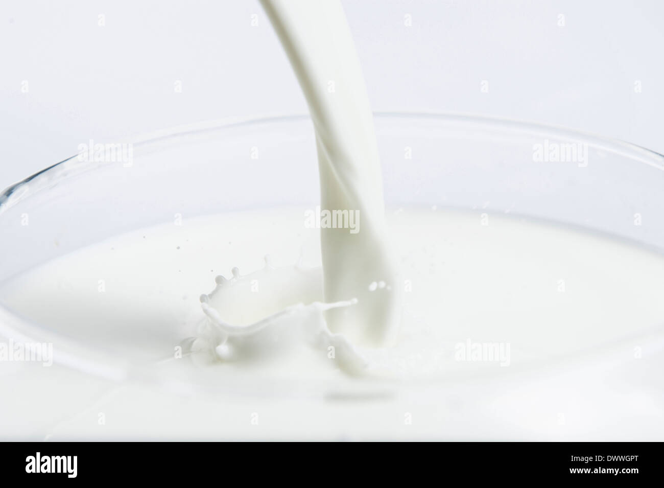 milk poured into a glass Stock Photo - Alamy