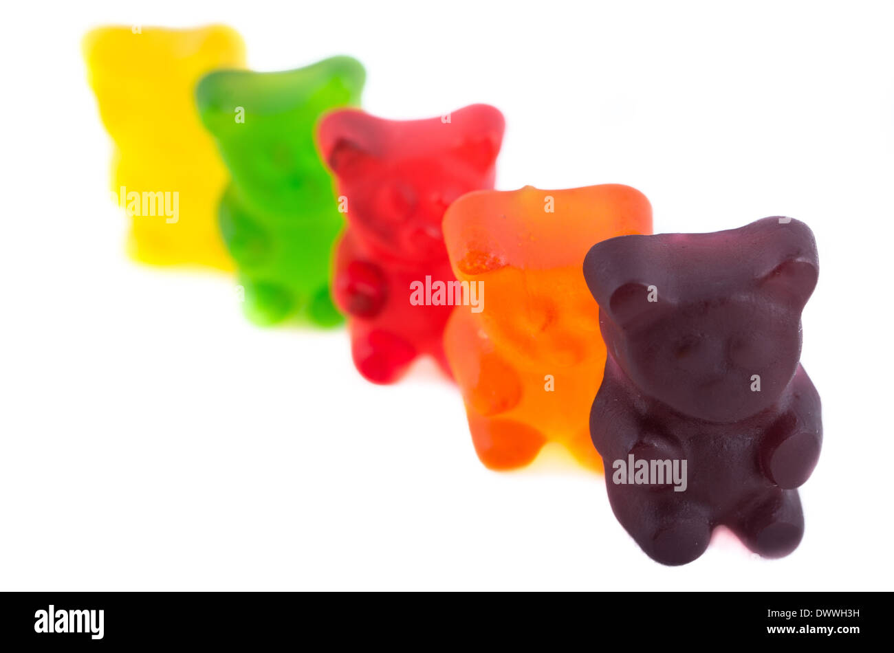 Row of colorful gummy bears on isolated white background Stock Photo ...