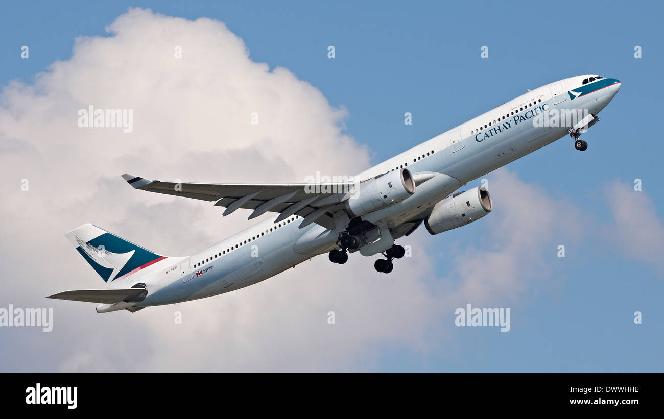 Cathy Pacific Passenger Aircraft taking off and climbing up at Hong ...