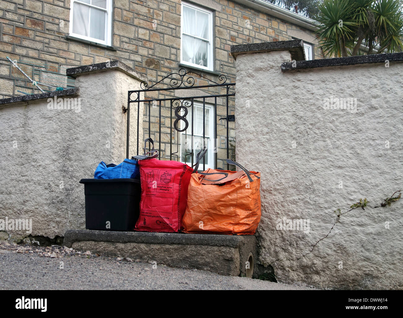 bags of household recycling on the step ready for collection Stock ...