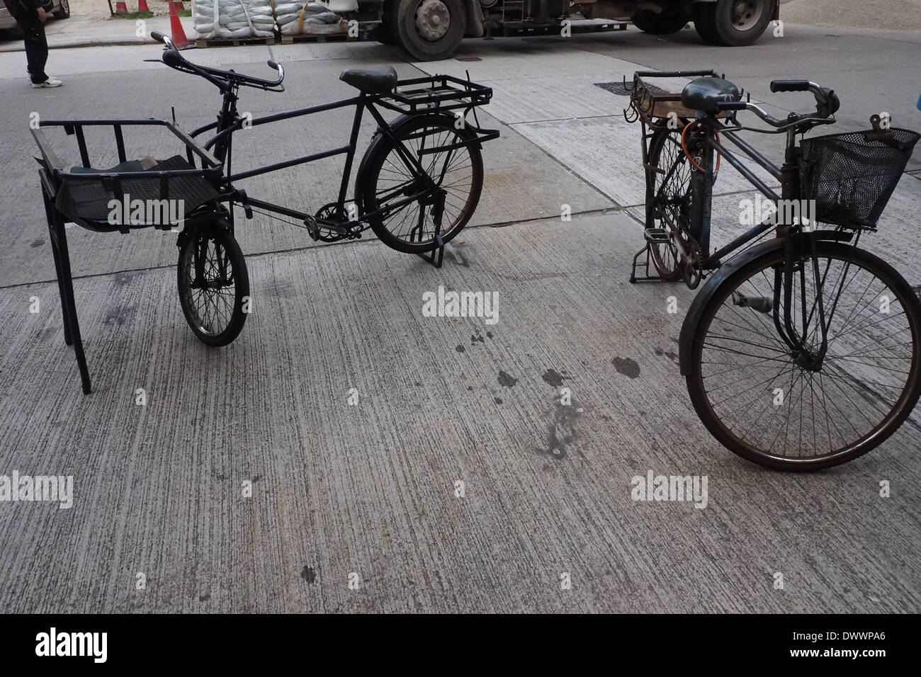 Two old workman's bicycles with large carriers Stock Photo - Alamy