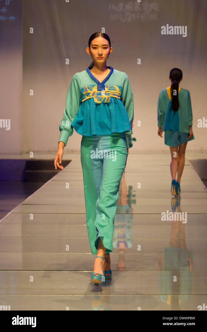 Beijing, China. 13th Mar, 2014. A model presents a creation from silk ...