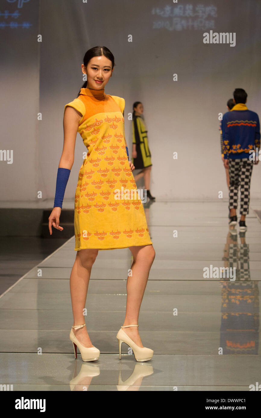 Beijing, China. 13th Mar, 2014. A model presents a creation from silk ...