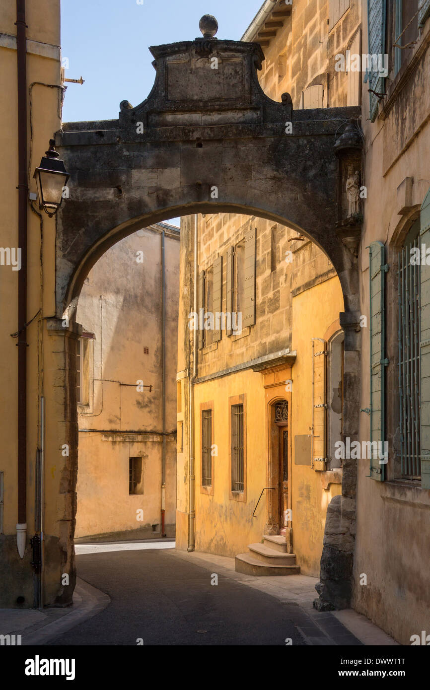 An old archway in a run down area of the old town of Arles in Provence ...