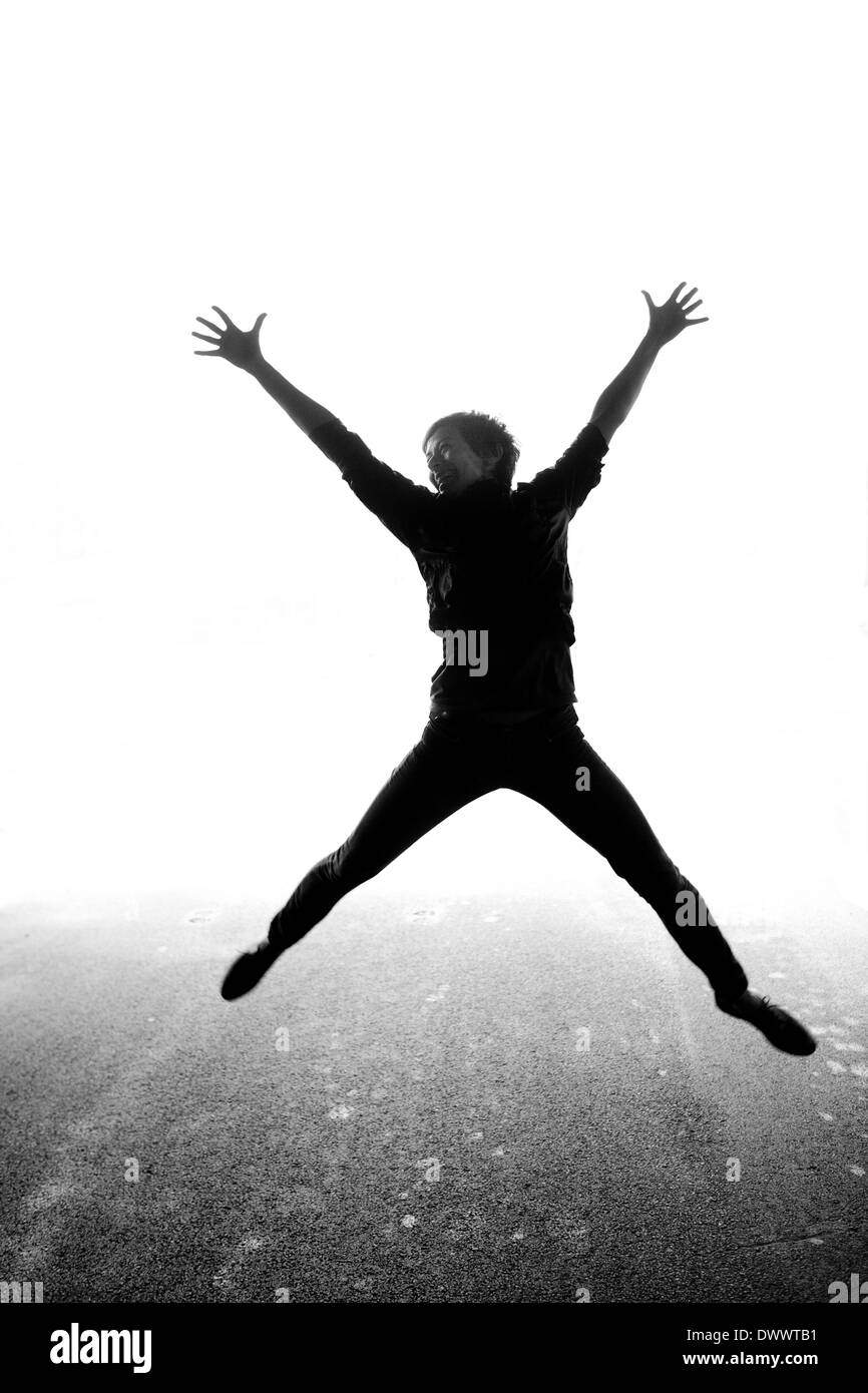 Jump for joy silhouette Black and White Stock Photos & Images - Alamy