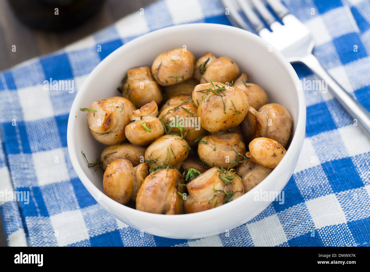 Pan sauteed mushrooms in a bowl Stock Photo - Alamy