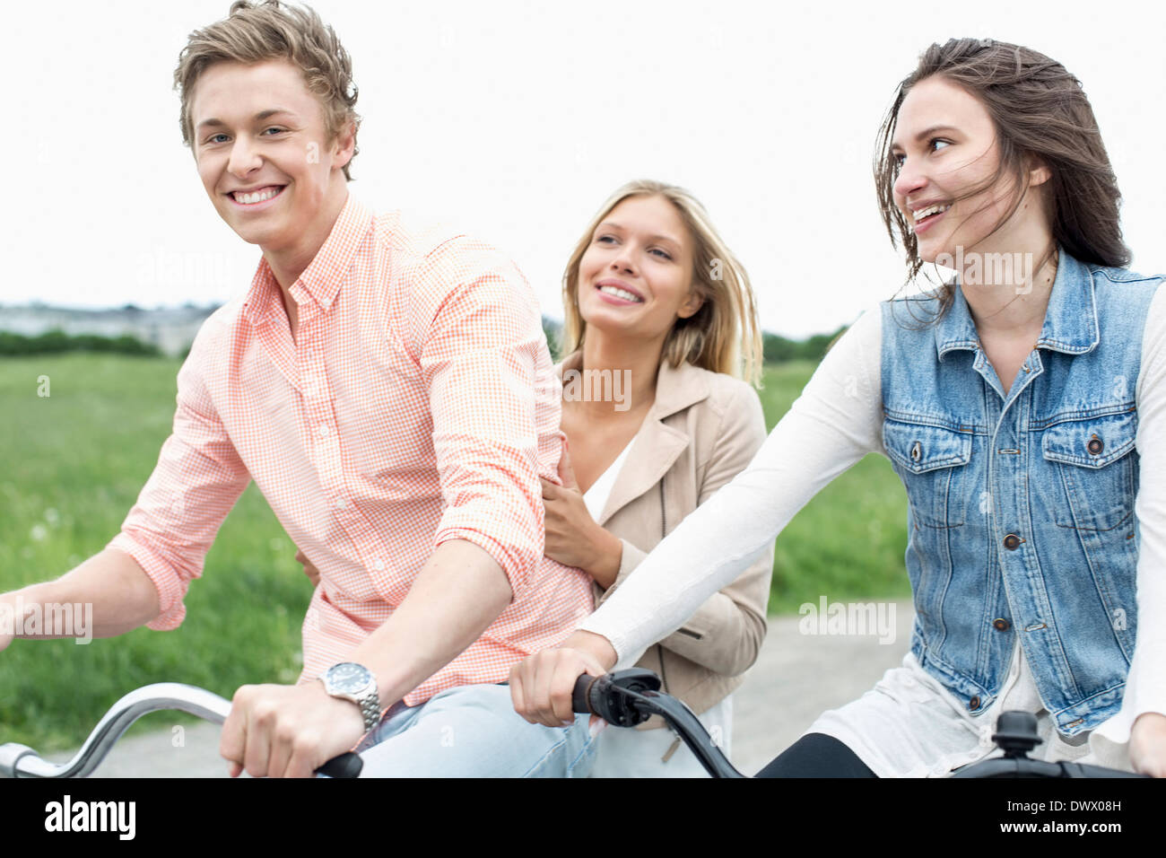 Happy young female friends enjoying a conversation on floor against ...