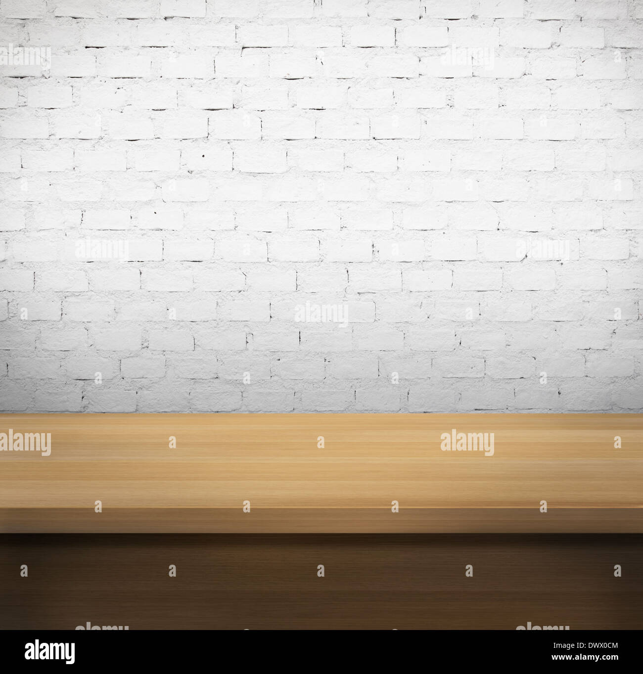 Wooden empty table with white brick wall Stock Photo - Alamy