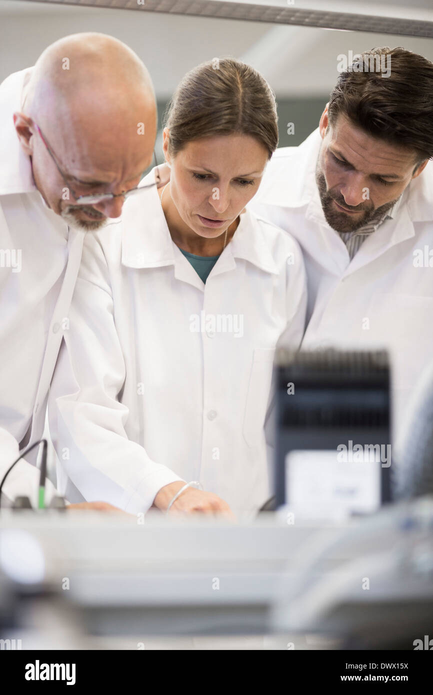 Team of engineers working in manufacturing industry Stock Photo - Alamy
