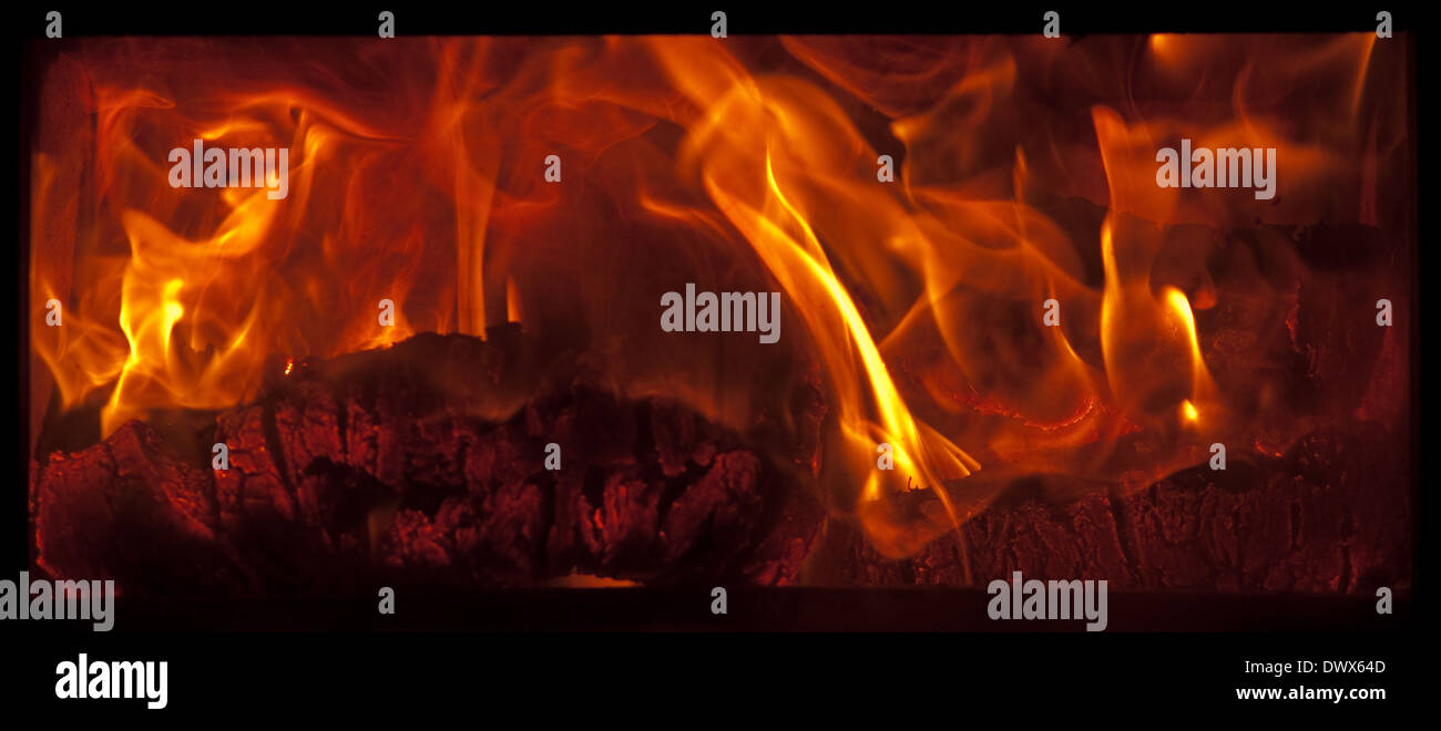 Flames in a wood burning stove Stock Photo - Alamy