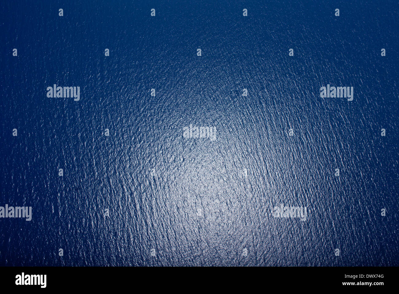 Sun reflecting on ocean surface Stock Photo - Alamy